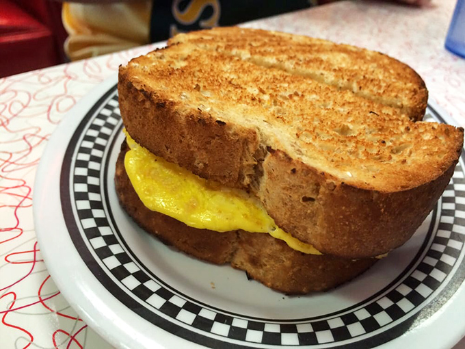 The humble egg sandwich, elevated to art form: perfectly grilled bread embracing a sunshine-yellow center. Simplicity that somehow tastes like childhood memories.