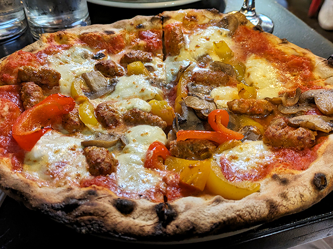 Pizza that makes you question your life choices. Why have you been eating anything else when this sausage and pepper masterpiece exists in the world?