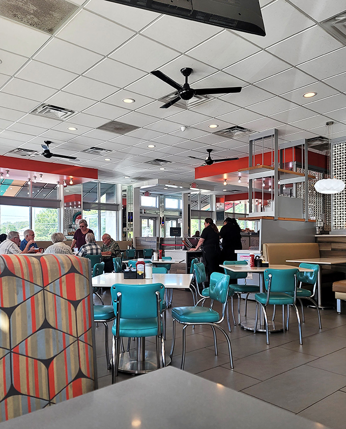 Turquoise chairs and striped booths create a retro-cool vibe that says, "Yes, we remember the '50s, but we've also discovered Wi-Fi."