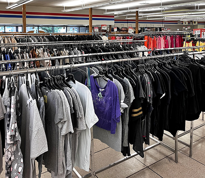 The shirt section&mdash;where corporate castoffs hang alongside vacation tees, creating a textile timeline of American fashion evolution.