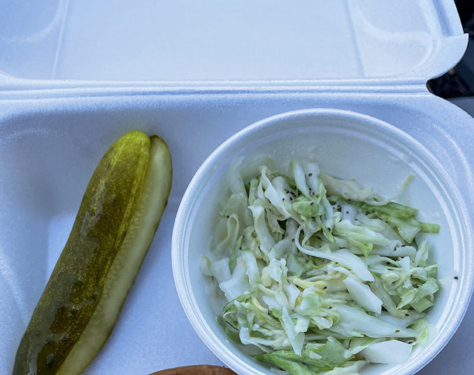 A pickle and coleslaw&mdash;the unsung heroes of any great sandwich meal, bringing that perfect acidic counterpoint to rich flavors.