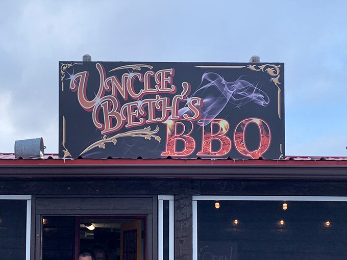The sign glows like a beacon of barbecue hope, promising smoky salvation to weary travelers and hungry locals alike.