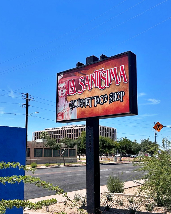 La Santisima's roadside sign stands as a beacon of hope for the hungry, promising authentic Mexican flavors in the heart of Phoenix.