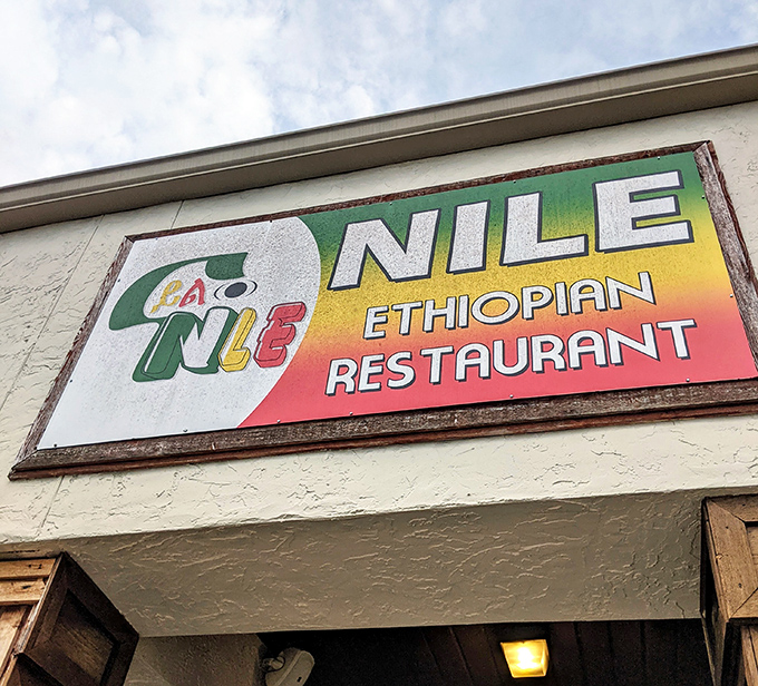 The vibrant sign announces its presence with pride, sporting the colors of the Ethiopian flag. It's not just a restaurant sign&mdash;it's a cultural beacon.