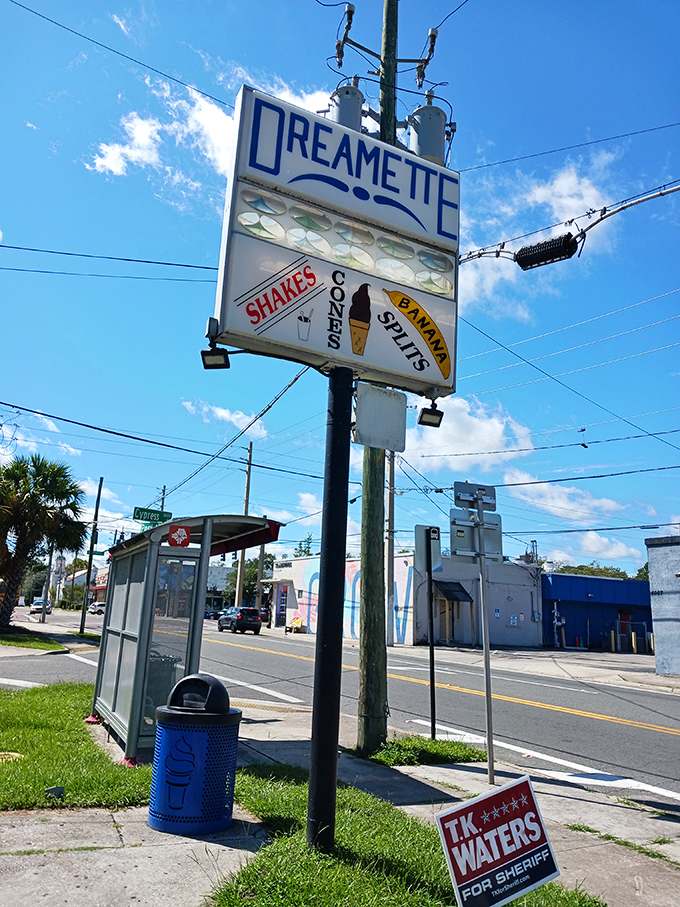 The vintage sign stands tall, a nostalgic lighthouse guiding sweet-toothed travelers to safe harbor since the mid-century.