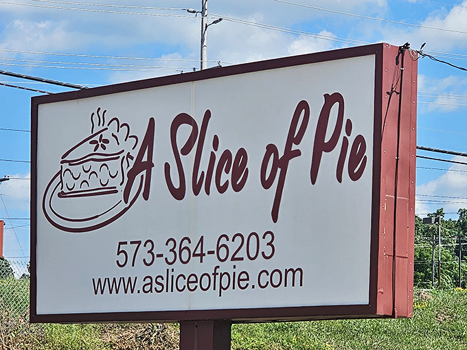 The roadside sign stands as a simple promise to travelers: extraordinary pie experiences await just off the highway.