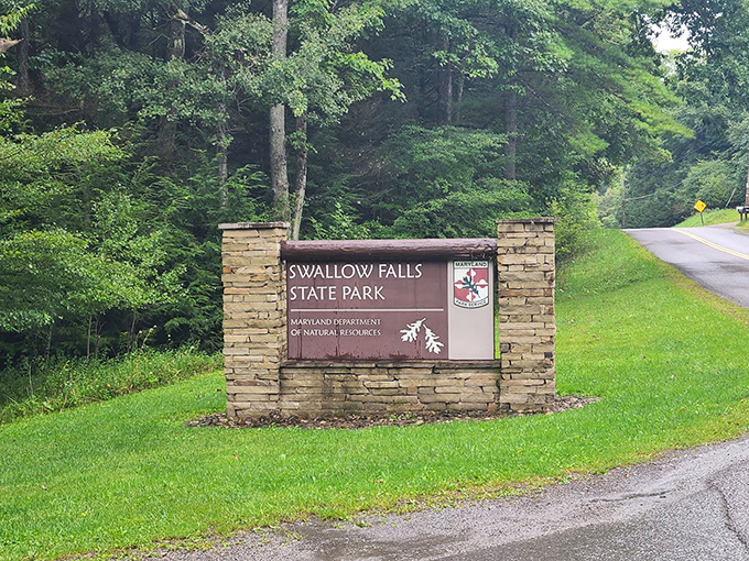 The welcoming gateway to Maryland's tallest free-falling waterfall, where adventure begins with a simple wooden sign.