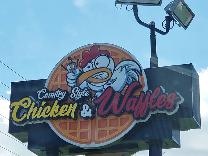 The roadside sign that beckons hungry travelers like a lighthouse for the famished. That cartoon chicken knows what you need.