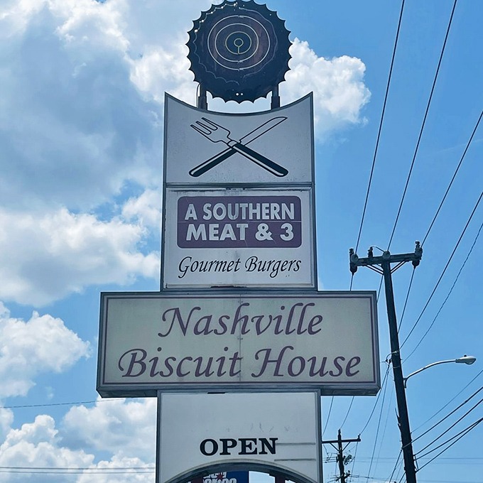 The roadside sign stands tall against Tennessee skies, a beacon for hungry travelers seeking authentic Southern breakfast without pretense.