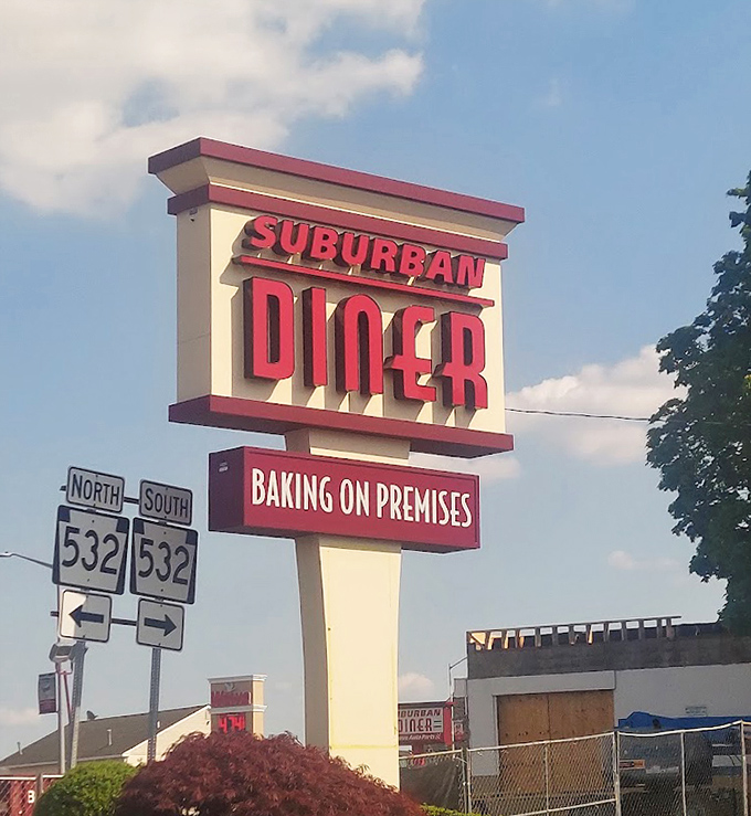 That sign against blue sky &ndash; a beacon of hope for hungry travelers and a landmark for locals seeking comfort food salvation.