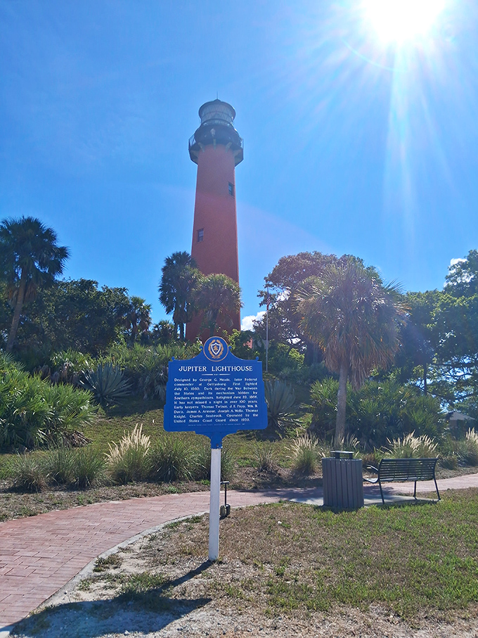 Even the historical marker seems to be saying, "Look up! The real attraction is that 108-foot tower of brick-red magnificence!"