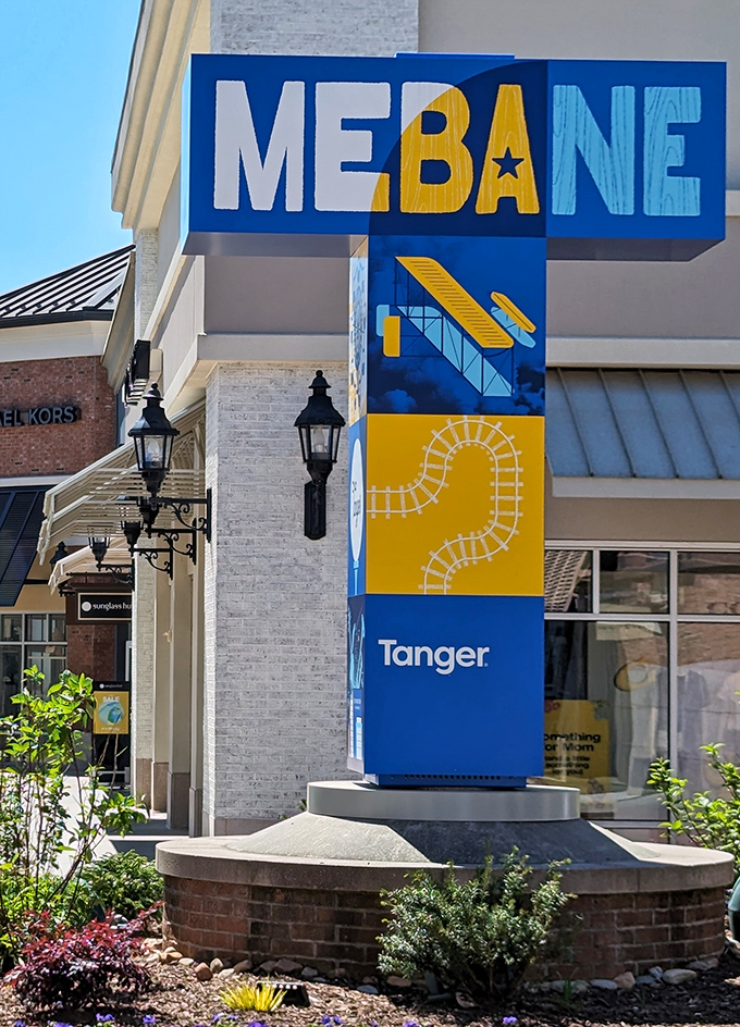 The distinctive Mebane sign incorporates local elements, welcoming shoppers to this retail paradise nestled between the Triad and Triangle.