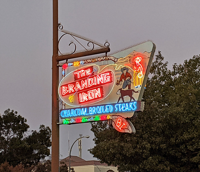 Charcoal broiled steaks get top billing on this vintage sign straight from yesteryear.