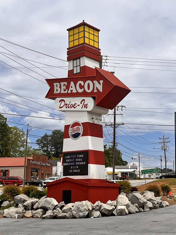 The lighthouse-inspired sign stands tall, guiding hungry souls to this temple of Southern comfort food like a caloric North Star.