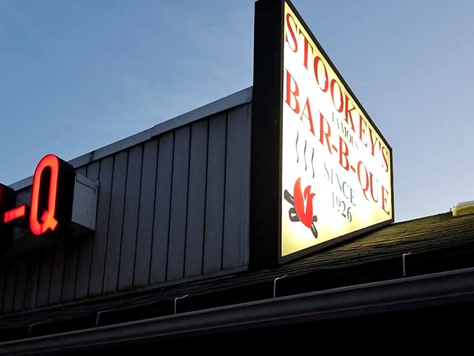 As the sun sets, that iconic sign glows like a beacon for barbecue pilgrims. Some people follow stars; the wise follow neon "Q" signs.