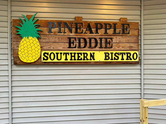 The rustic wooden sign with its bright pineapple mascot doesn't just mark a restaurant &ndash; it marks the spot where flavor treasure is buried.