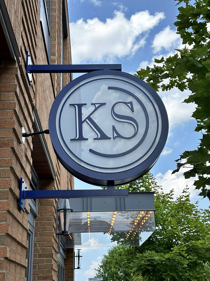 The KS sign against blue sky feels like a beacon for hungry travelers. This circular emblem has become a symbol of Dublin's evolving food scene.