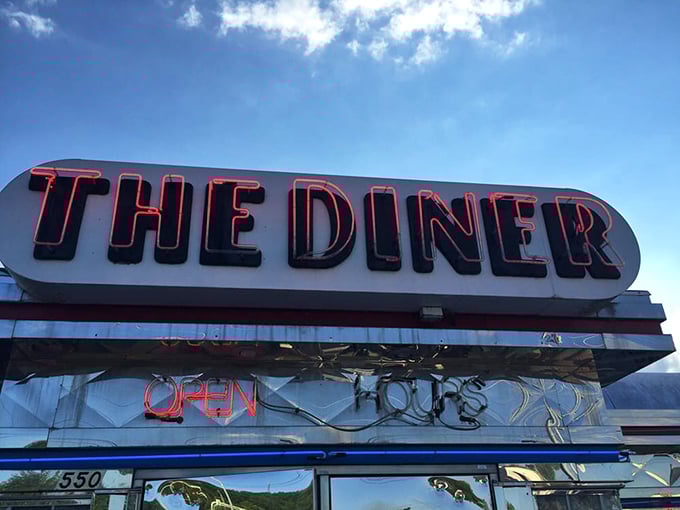 The neon sign glows like a lighthouse for hungry travelers. When you see "THE DINER" illuminated, you know you've found safe harbor.