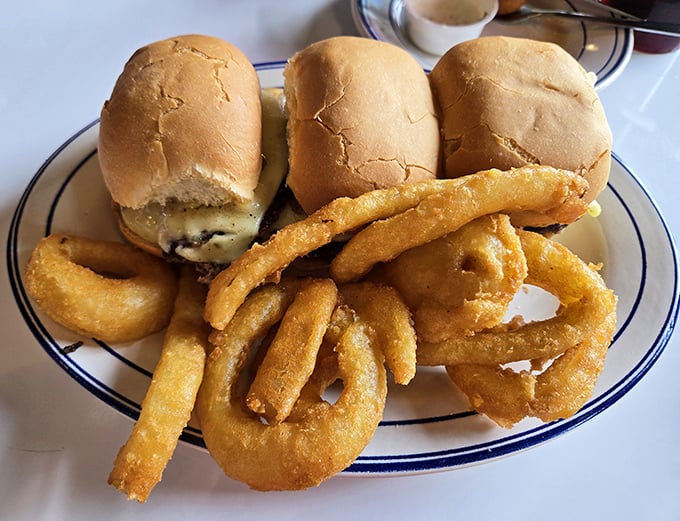 Sliders that prove good things come in small packages, flanked by onion rings standing at attention. A plate that demands to be photographed before devoured.