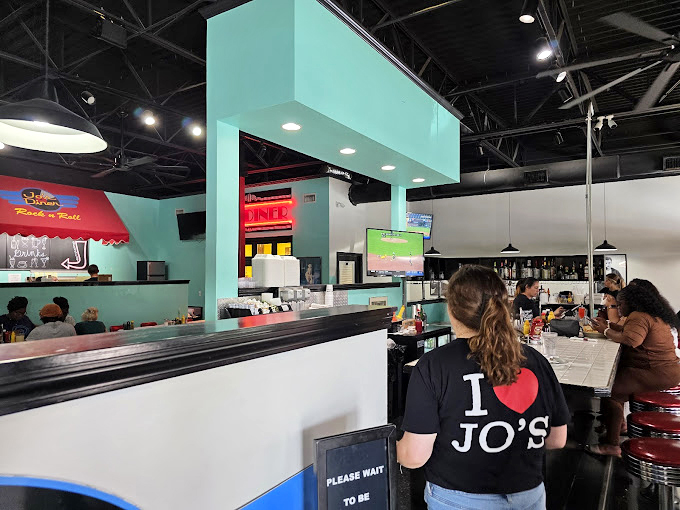 Staff wearing "I ❤️ Jo's" shirts aren't just employees&mdash;they're ambassadors of comfort food diplomacy, bringing peace through perfect portions.
