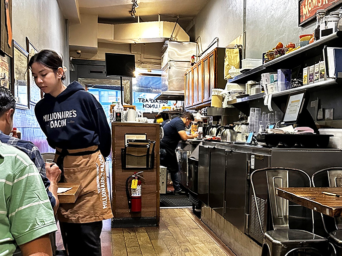 Staff members sporting "Millionaires Bacon" gear&mdash;because when your bacon is this good, it deserves its own merchandise line.