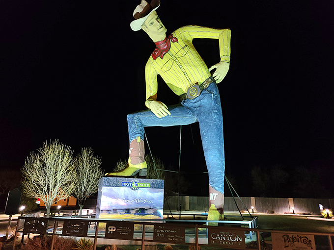 Tex looks magnificent under nighttime lighting, transforming from daytime landmark into an illuminated beacon of quirky American roadside artistry.