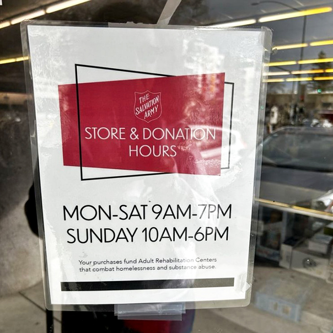 The store hours sign reminds shoppers that their bargain hunting also funds programs that help the community&mdash;shopping with purpose.