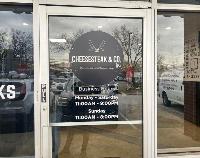 Business hours posted clearly – because knowing exactly when you can satisfy your cheesesteak craving is essential information for proper life planning.