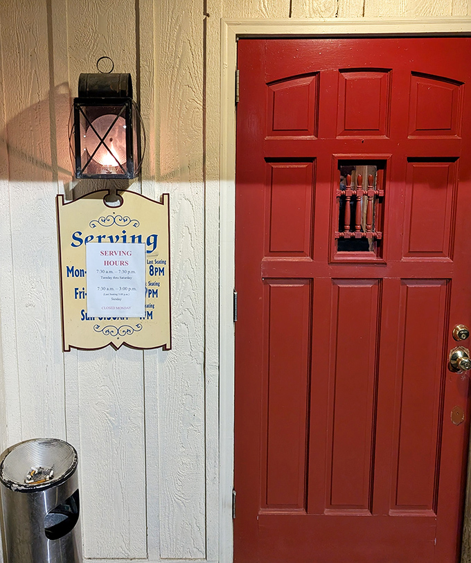The red door and vintage lantern say "welcome" more authentically than any neon sign ever could. Simple pleasures await inside.