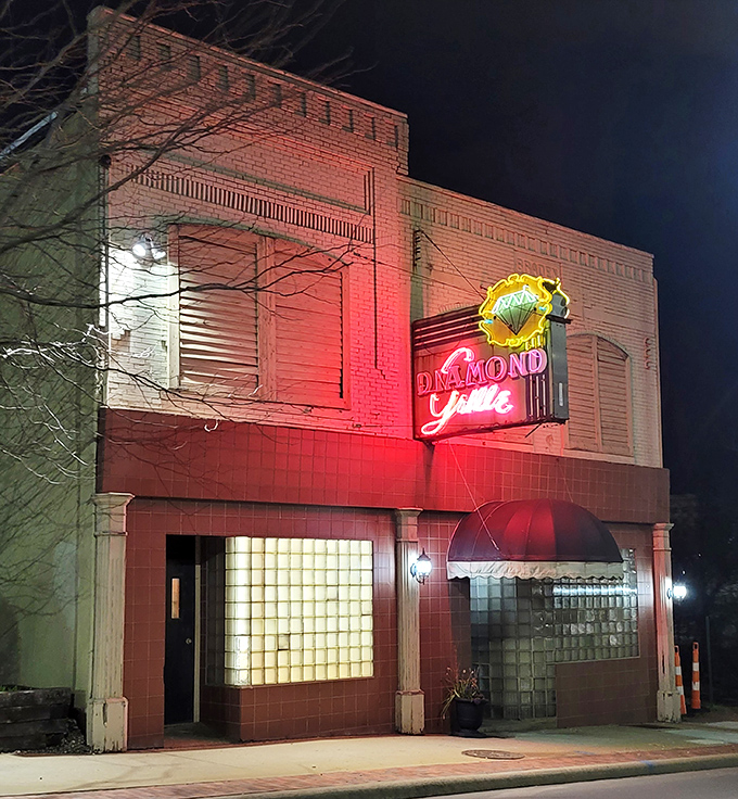 By night, the Diamond Grille transforms into a beacon for the hungry and discerning. That glow says "exceptional dining experience" in neon-speak.