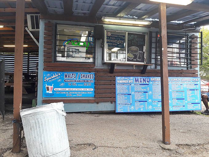 The order window&mdash;where dreams are placed and fulfilled. Blue menus announce the treasures waiting inside this wooden treasure chest.
