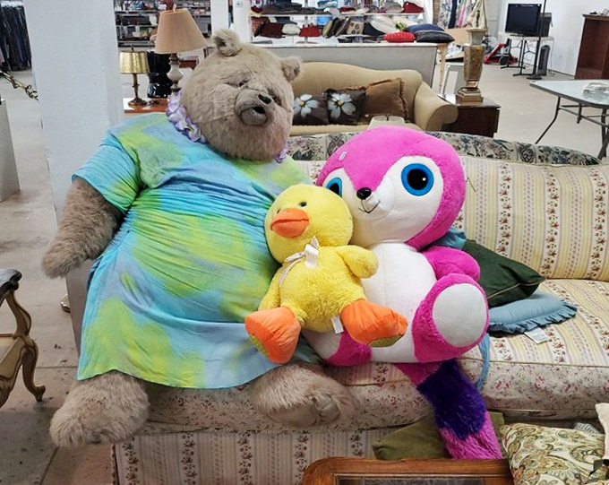 A teddy bear family reunion on a vintage couch—plush companions waiting to bring comfort to new homes at a fraction of retail therapy prices.