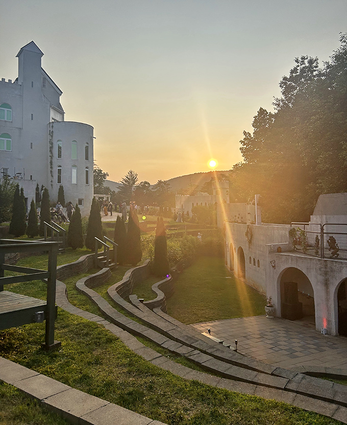 Sunset gatherings in the castle's amphitheater offer magical moments where fantasy and reality blur into golden-hued perfection.