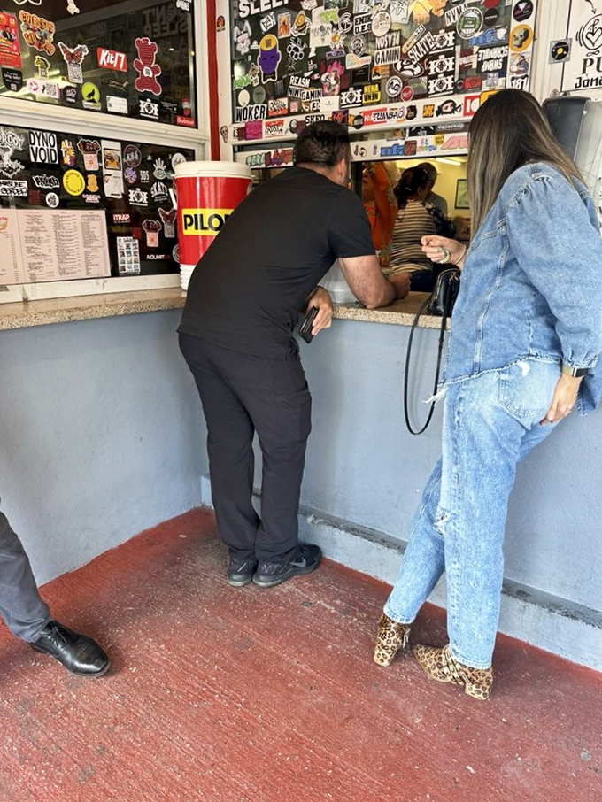 The takeout window &ndash; Miami's version of a drive-through. Covered in stickers and memories, it's where locals grab Cuban coffee strong enough to jumpstart your day.