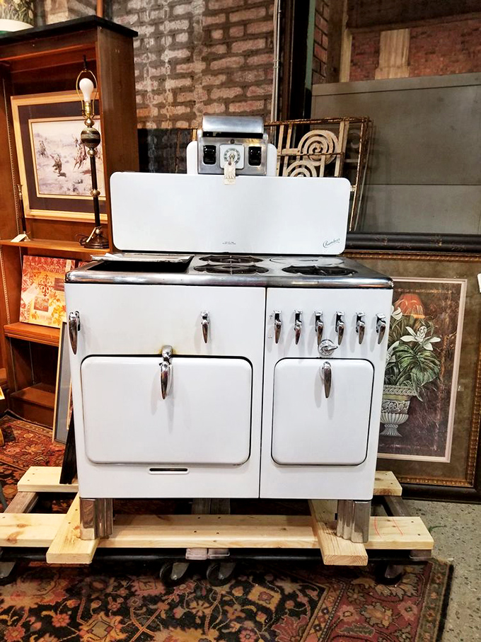 This gleaming white vintage stove isn't just an appliance; it's a time machine to grandmother's kitchen and Sunday pot roasts.