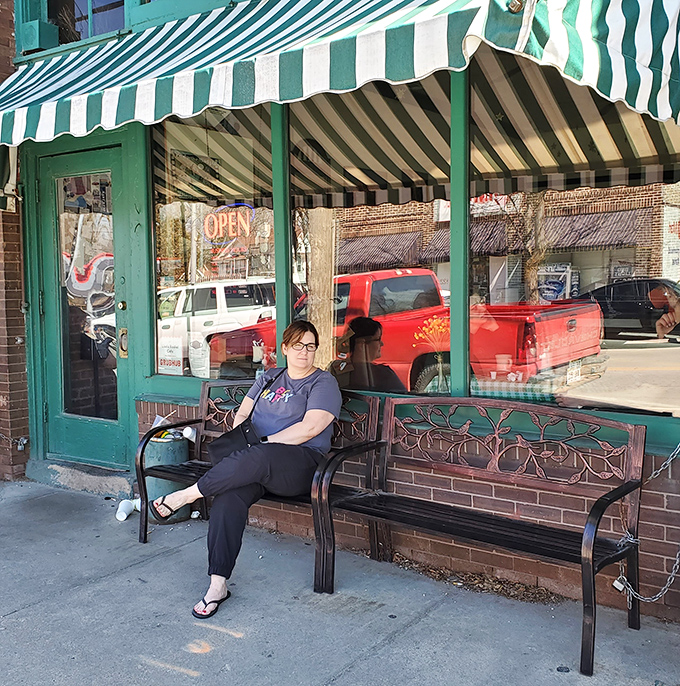 The sidewalk bench where anticipation builds and weekend warriors patiently wait for their turn at breakfast glory.
