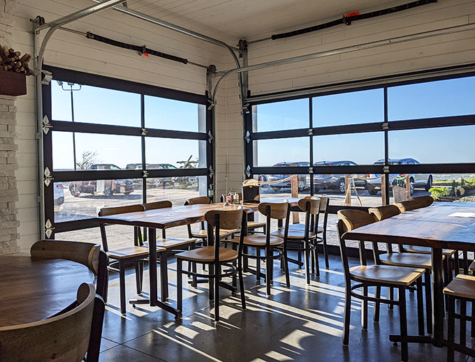 Garage-style windows flood the dining area with natural light, creating the perfect backdrop for that all-important food photography session.