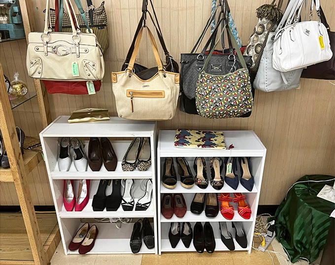 The accessories corner&mdash;where designer bags hang like ripe fruit above shelves of shoes that have stories to tell but secrets to keep.