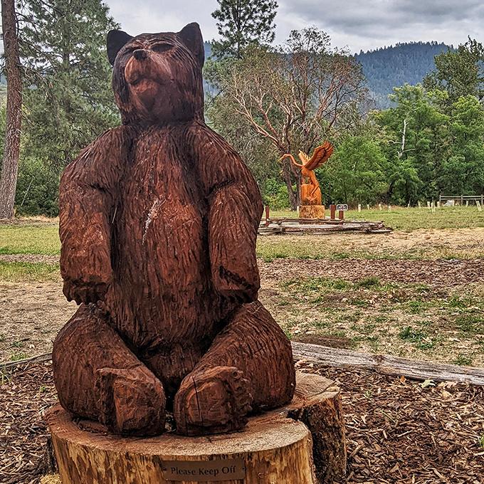 Bear necessities of park art. This wooden sculpture serves as both trail decoration and the perfect spot for an impromptu family photo.