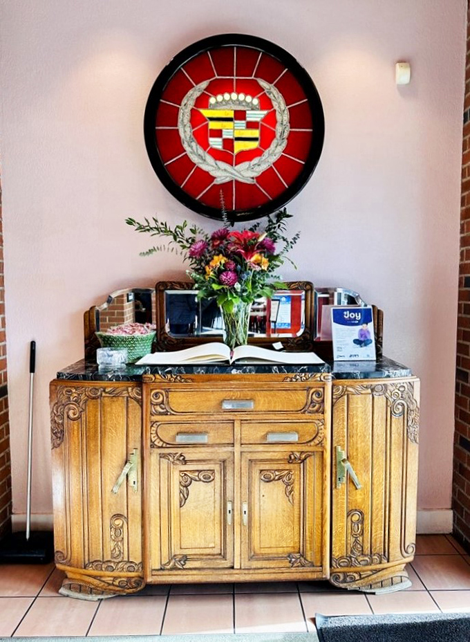 The Cadillac emblem shines like a stained-glass beacon for hungry pilgrims seeking salvation in the form of perfect hollandaise.