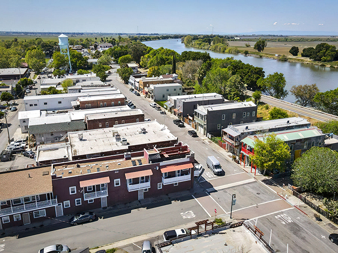From above, Isleton reveals its perfect positioning along the Sacramento River, a tiny jewel set within the emerald landscape of the Delta.
