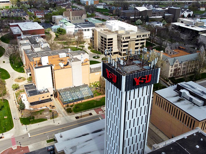 Aerial views reveal a compact city where everything's walkable and your car stays happily parked.