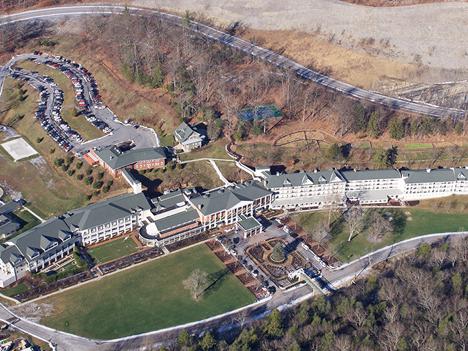 The Bedford Springs Resort, seen from above, sprawls majestically against the landscape—a grand dame who's welcomed presidents and everyday folks alike.