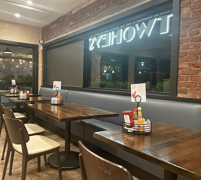 Rustic wooden tables against exposed brick walls create that perfect "I've discovered something special" atmosphere that makes regulars out of first-timers.