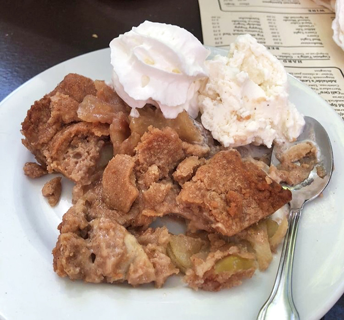 Sweet finale: This apple cobbler isn't just dessert&mdash;it's warm nostalgia topped with ice cream, the perfect ending to your mountain adventure.