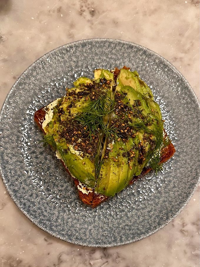 This isn't just avocado toast&mdash;it's a canvas of creamy green adorned with za'atar, dill, and other Middle Eastern flourishes that elevate breakfast to an art form.