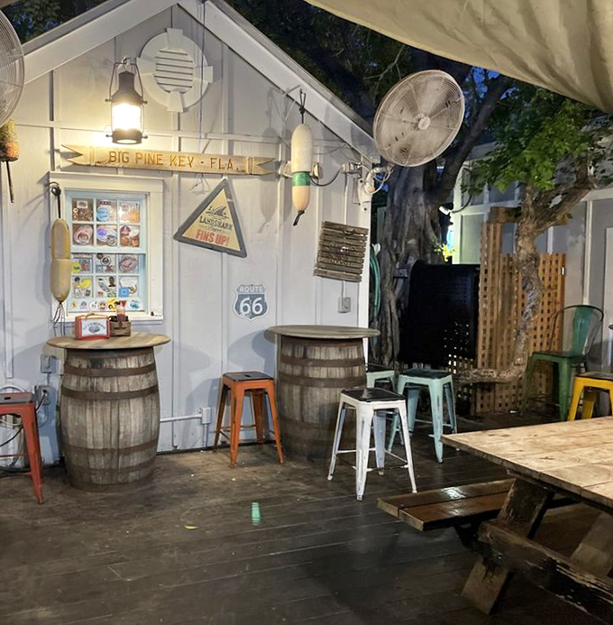 The back patio's barrel tables and colorful stools create the perfect casual backdrop for seafood feasts under the Florida stars.