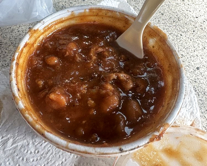 These beans have been to finishing school&mdash;they've learned the art of absorbing smoke flavor while maintaining their dignity in a sea of sauce.