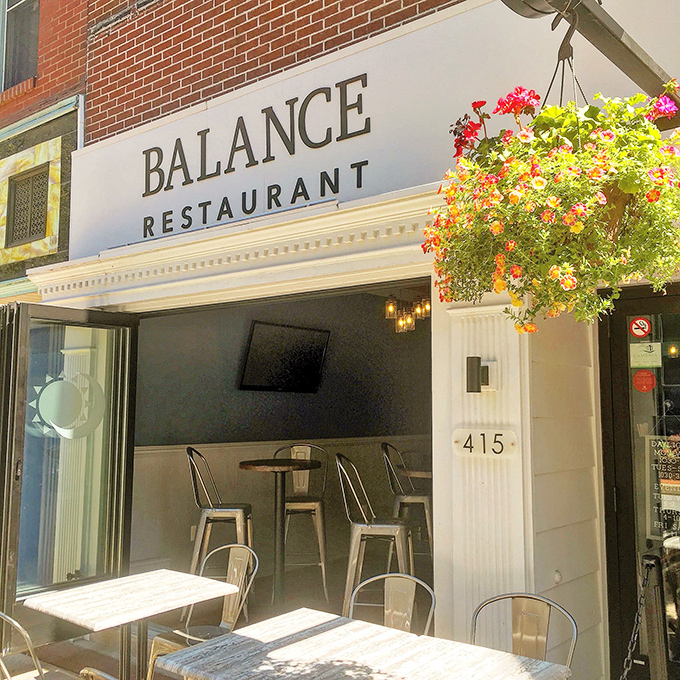 Balance Restaurant's inviting patio practically whispers, "Sit down, stay awhile," as hanging flowers dance in the breeze above outdoor tables.