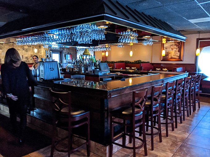 The bar's blue lighting creates an atmosphere that's part sophisticated Italian bistro, part place where everybody might know your name after a few visits.